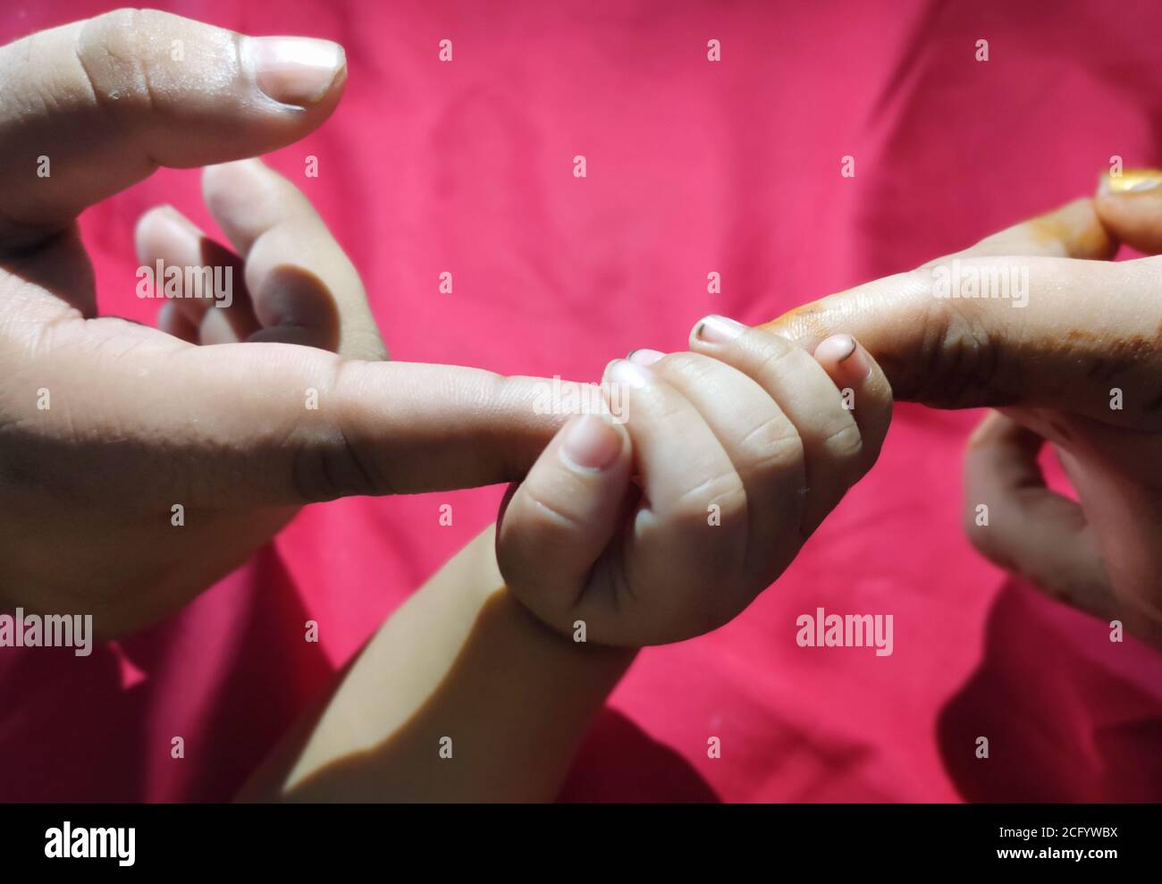 Infant holding hi-res stock photography and images - Alamy