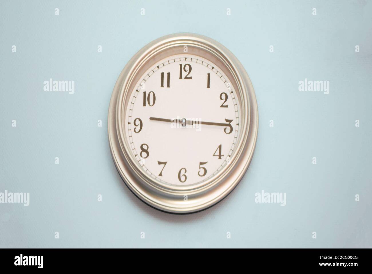 On blue background. View from front. Time of nine hours fifteen minutes ...