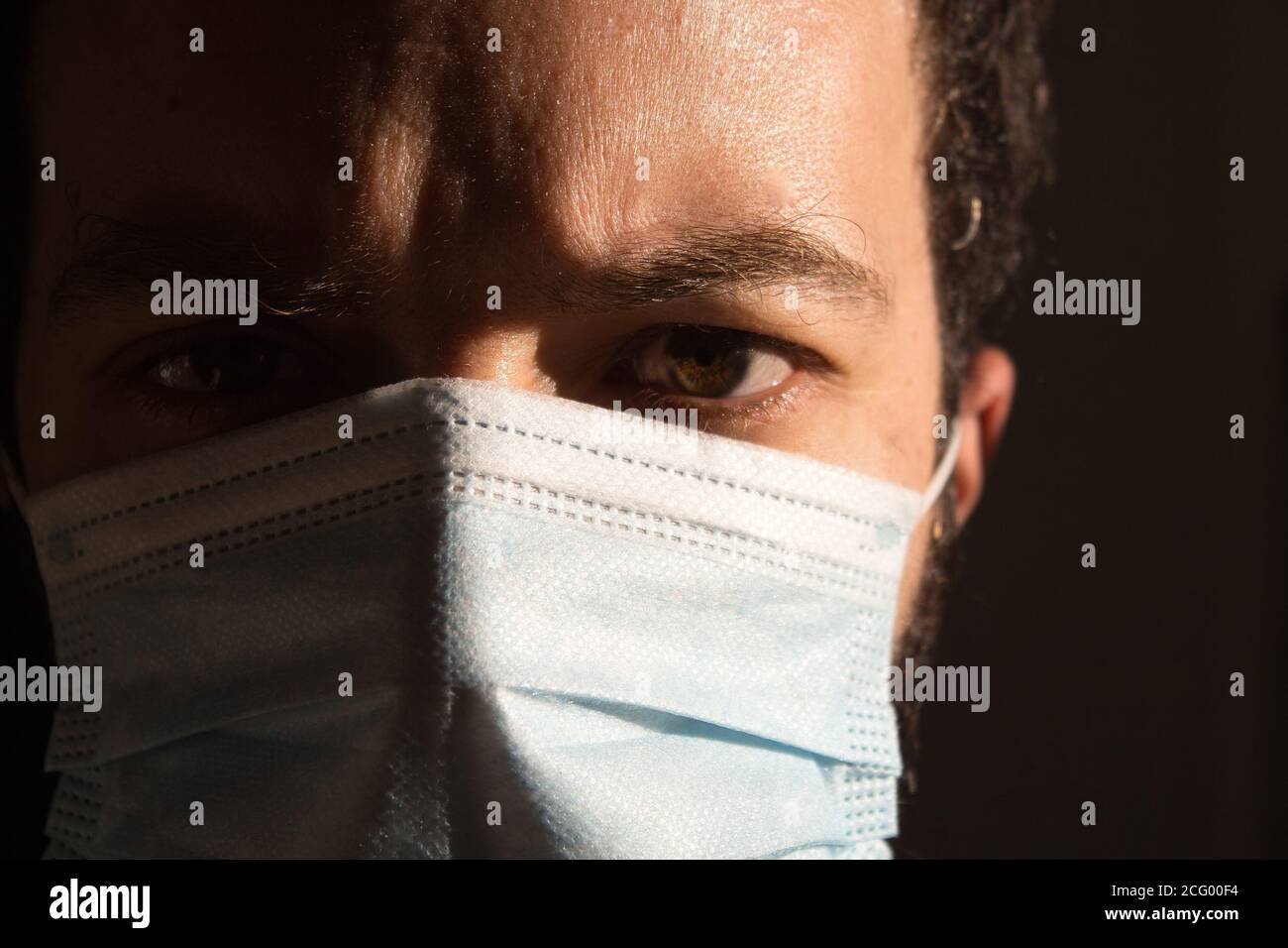 Black man wearing a covid mask hi-res stock photography and images - Alamy