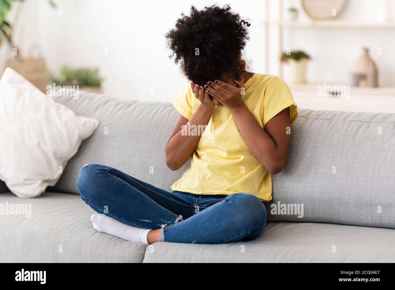 Depressed African Girl Crying Covering Face Feeling Sad Sitting Indoor ...