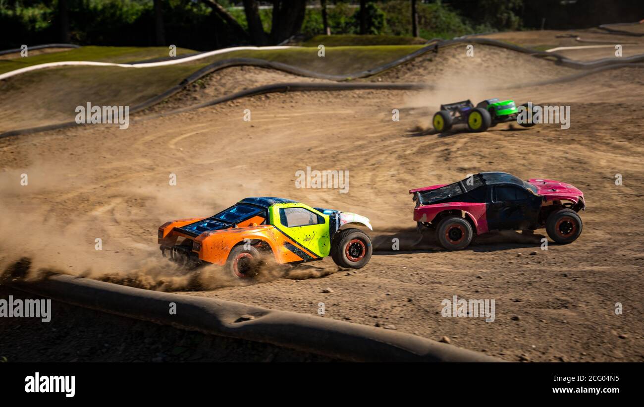 Three offroad RC cars turning into a sharp turn Stock Photo - Alamy