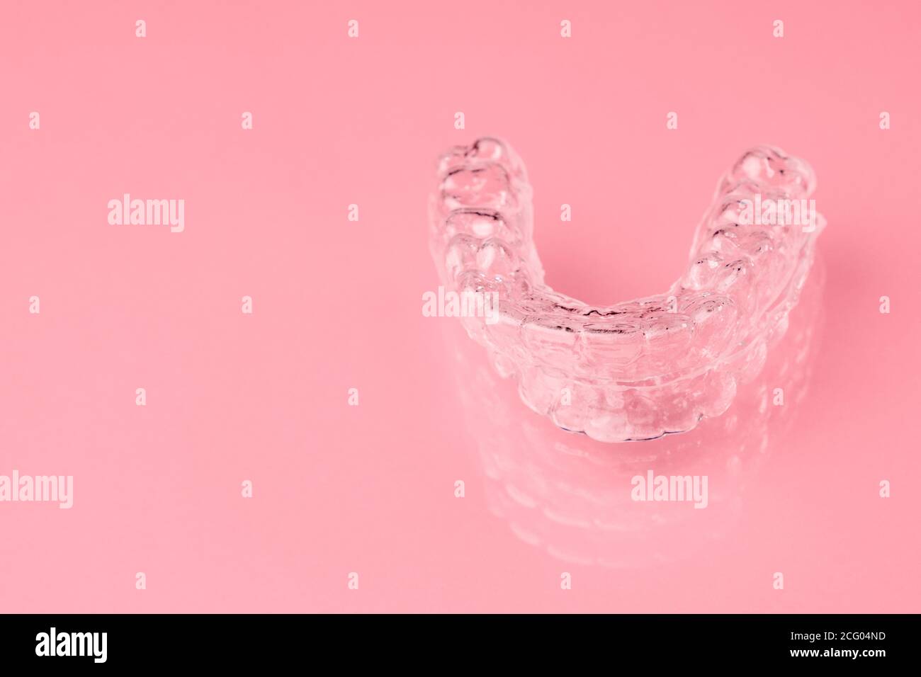 Invisible aligner or retainer for the lower teeth on the pink ...