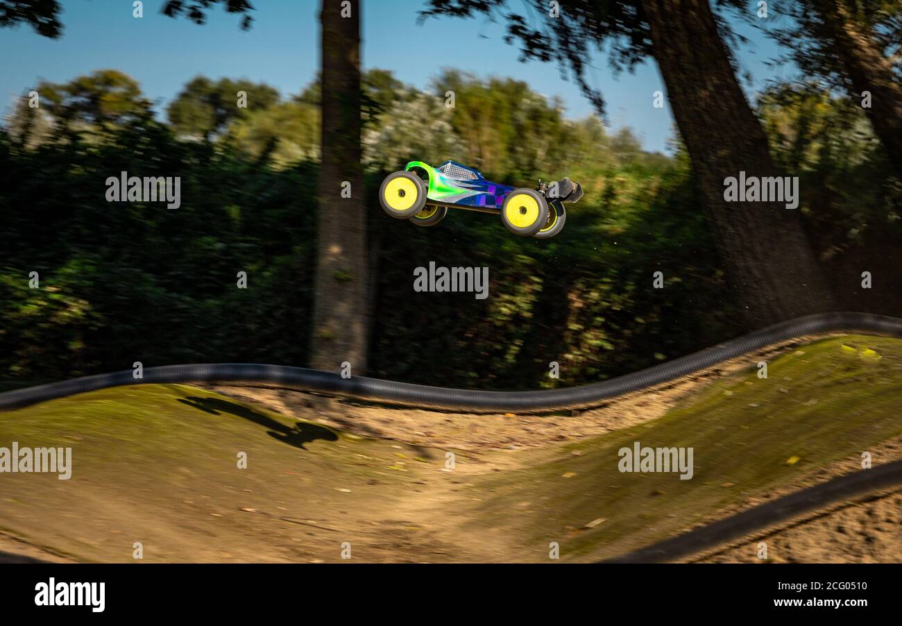 1/8 Offroad RC truggy jumping on a track Stock Photo - Alamy