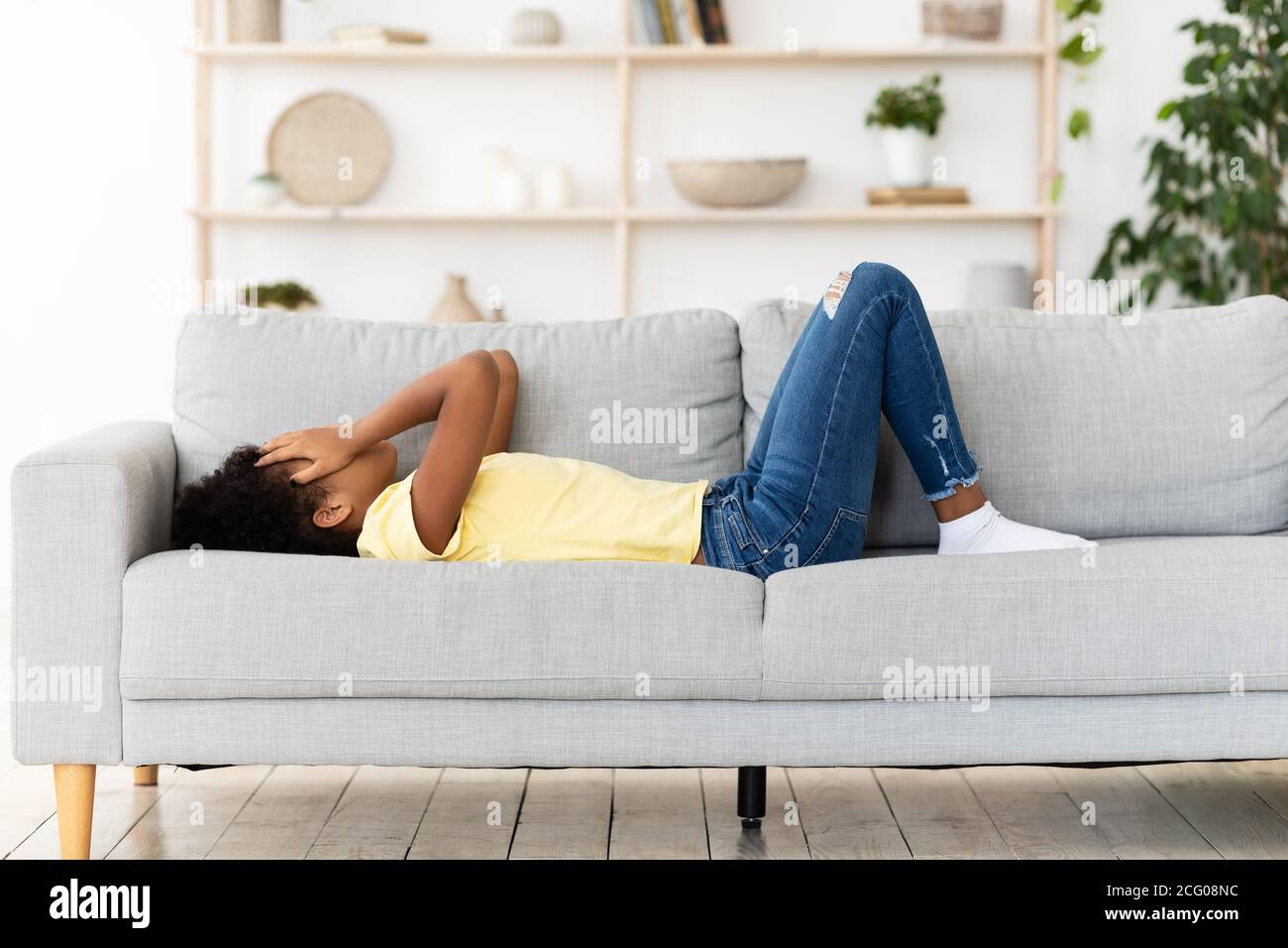 Sad teenager girl lying on hi-res stock photography and images - Alamy
