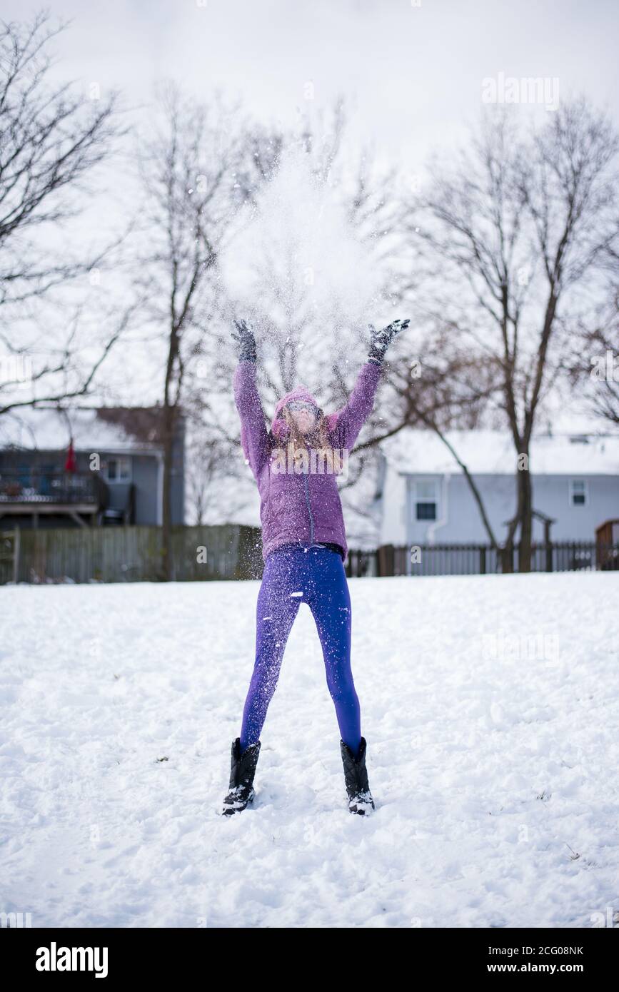 Girl throwing snow in air hi-res stock photography and images - Alamy