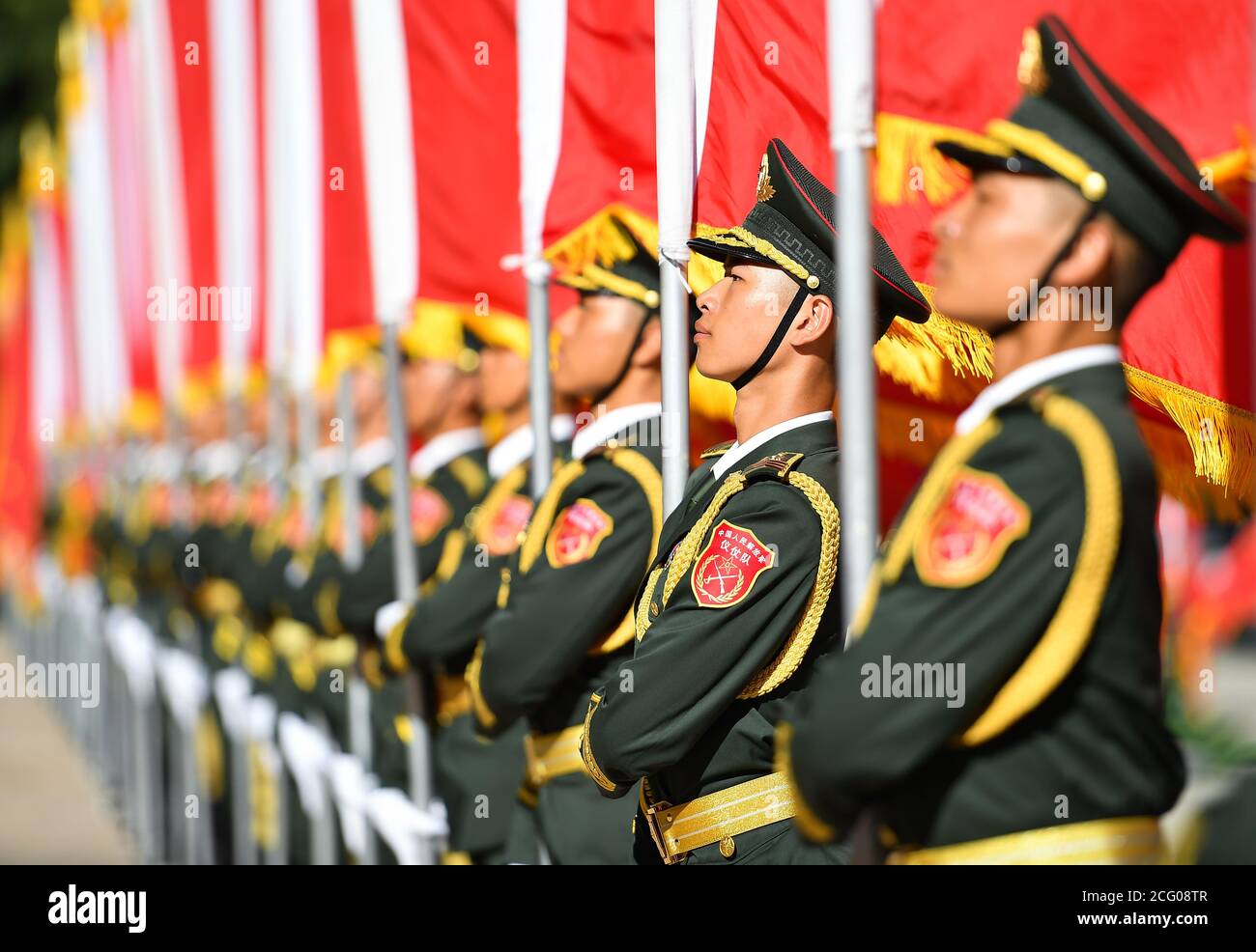 Beijing, China. 8th Sep, 2020. The honor guard hold red flags outside ...