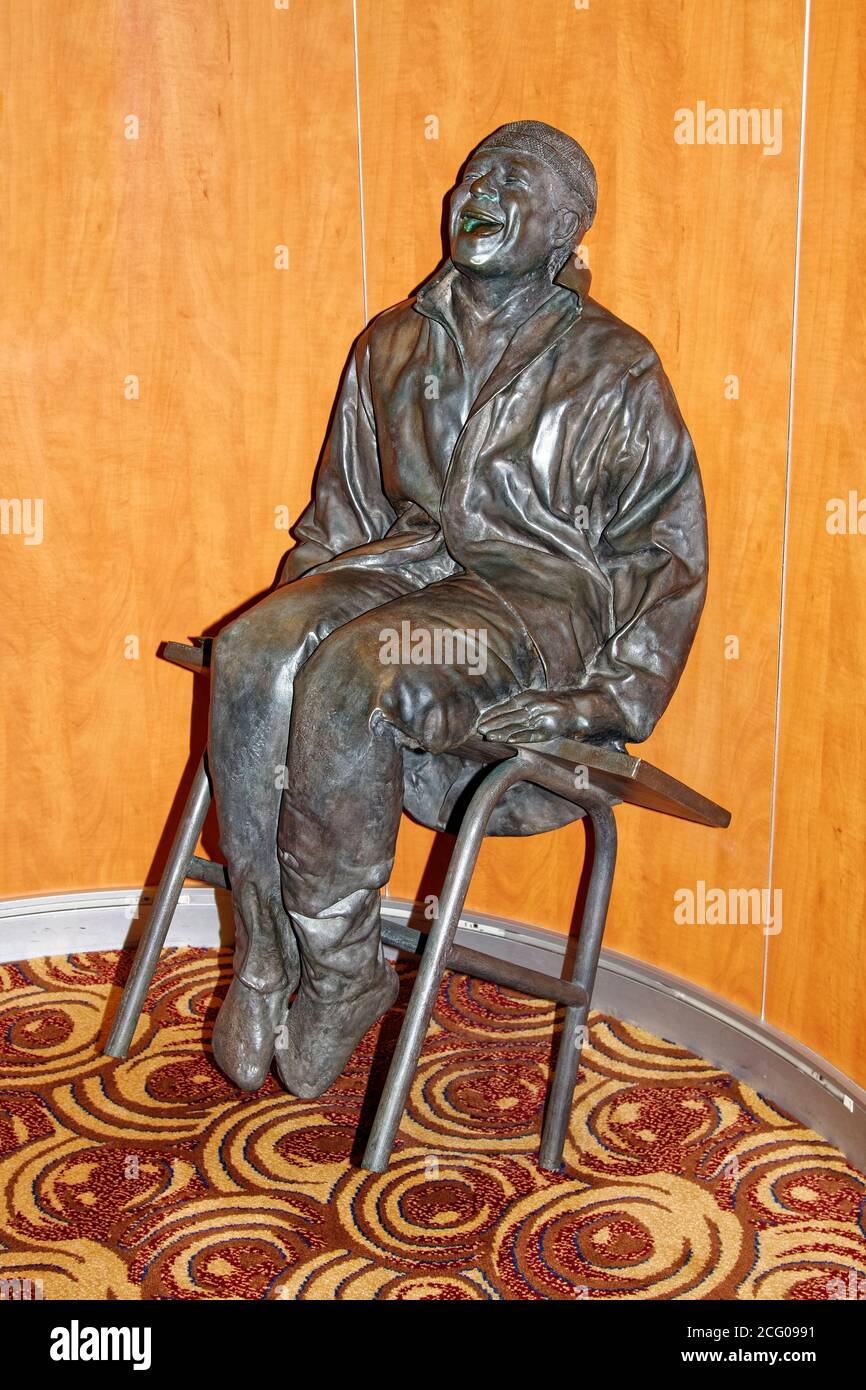 statue, man laughing, sitting in chair, tilted back, art Stock Photo ...