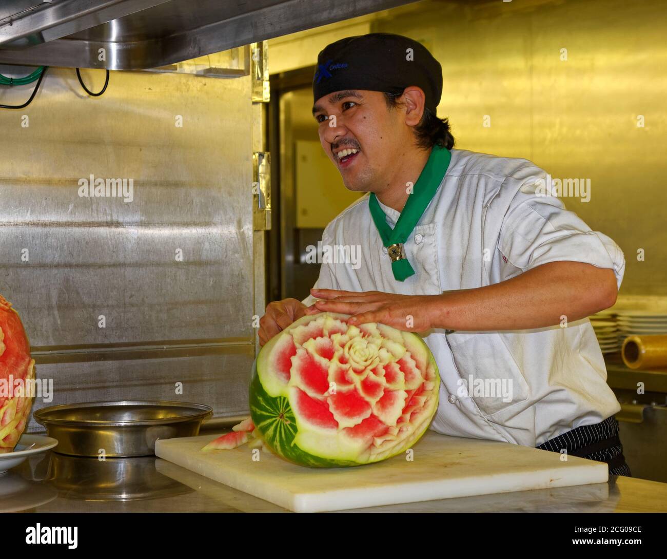 Assistant chef carving watermelon hi-res stock photography and images ...