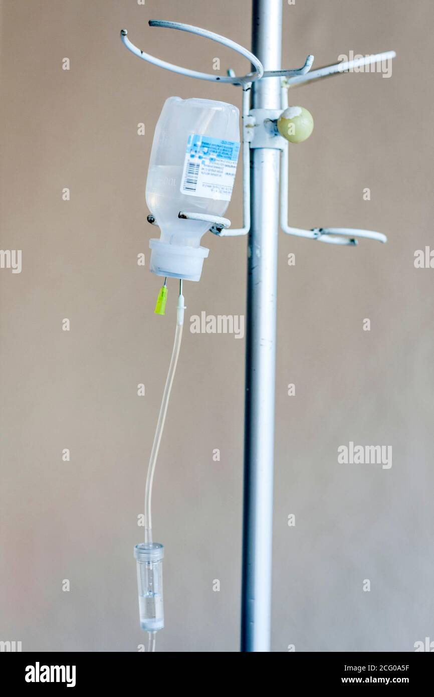 Close-up bottle of medicine on dropper system in the operating room ...