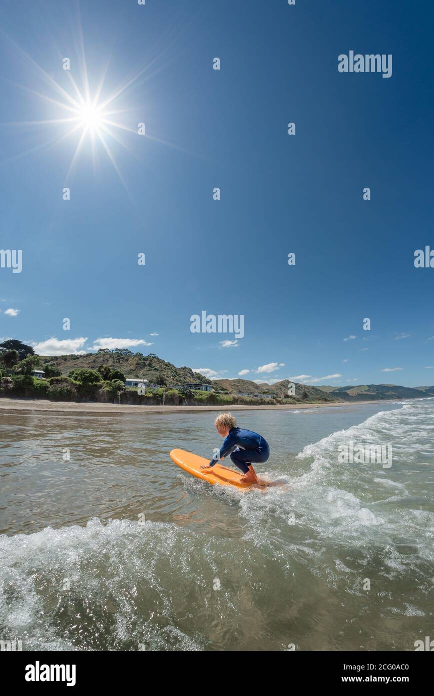 Children surfing waves blue hi-res stock photography and images - Alamy