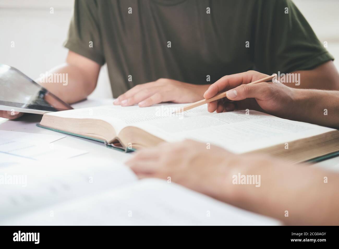 Learning, education and school concept. Young woman and man studying ...