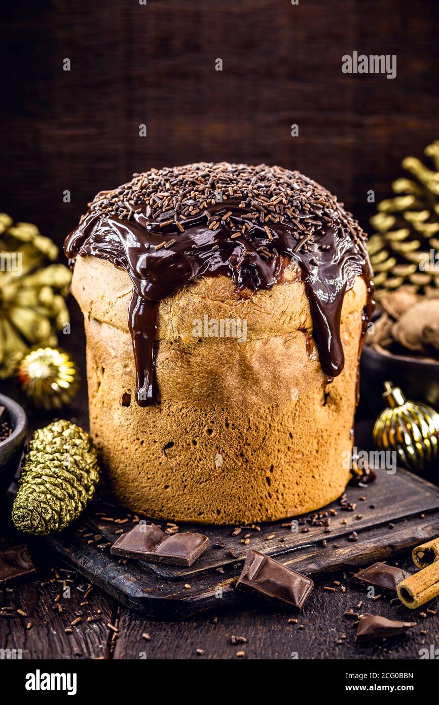 chocolate panettone isolated on rustic wooden background, space for ...