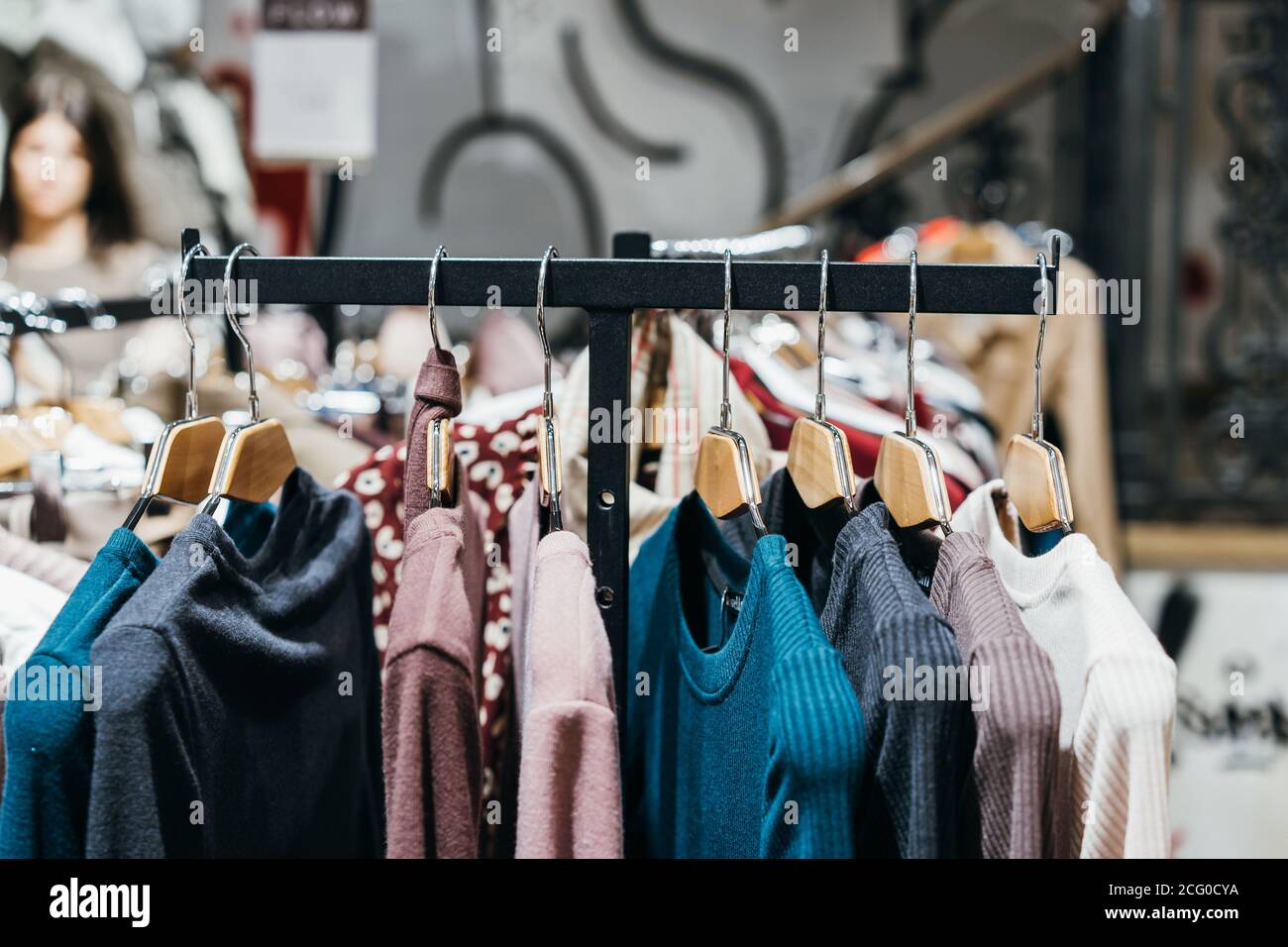 fashion clothing on hangers at the show Stock Photo - Alamy