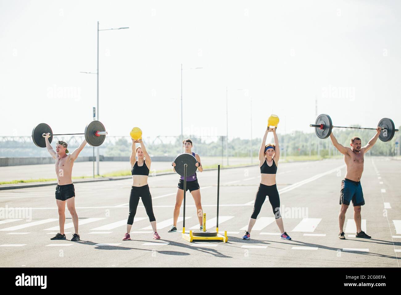 group of athletes doing different exercises outdoor Stock Photo - Alamy