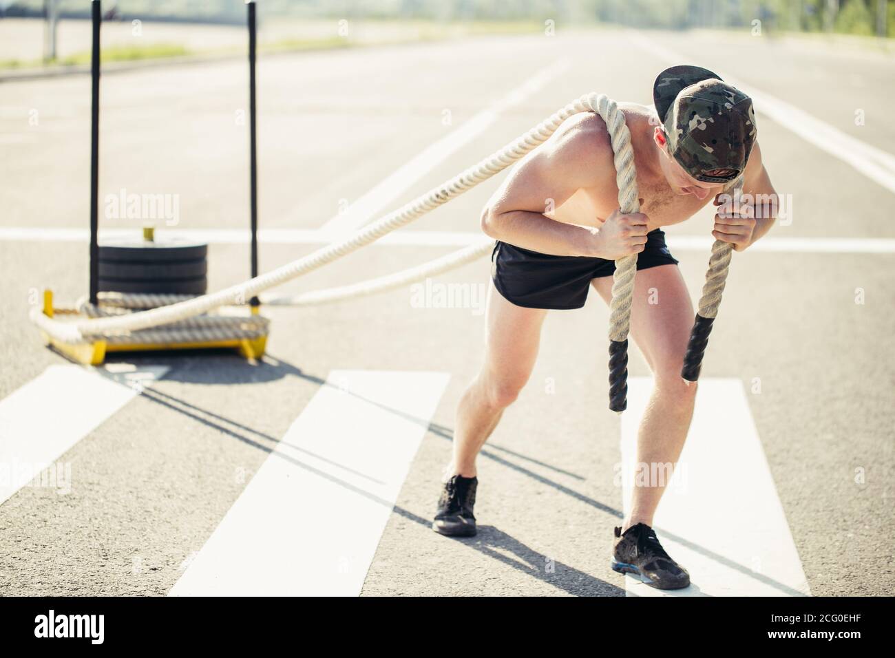 Sled push man pushing weights hi-res stock photography and images - Alamy