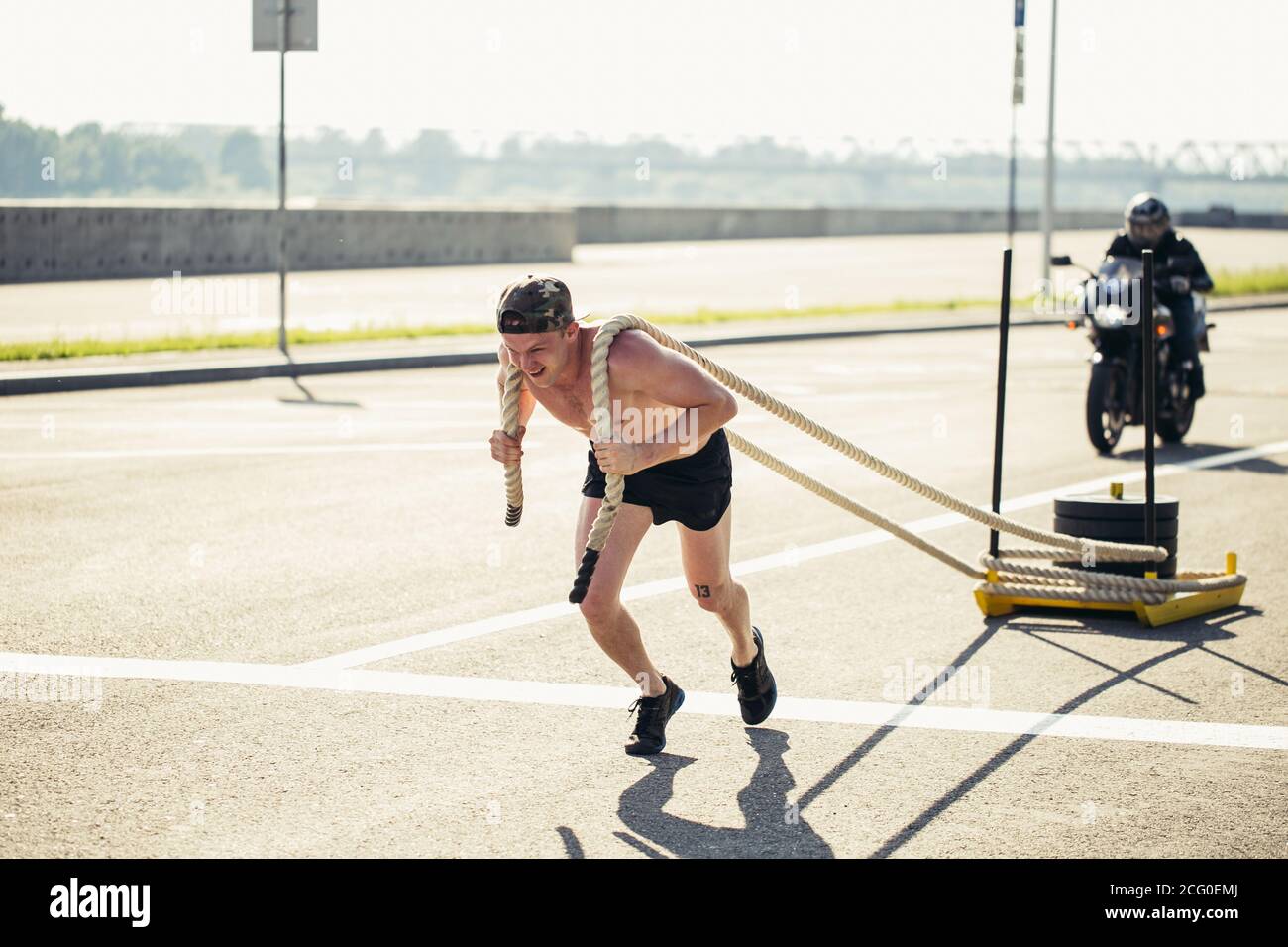 Sled push man pushing weights hi-res stock photography and images - Alamy