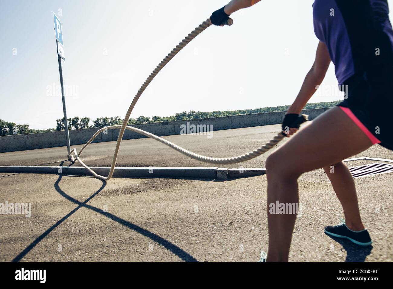battling ropes woman outdoor workout exercise fitted body Stock Photo ...