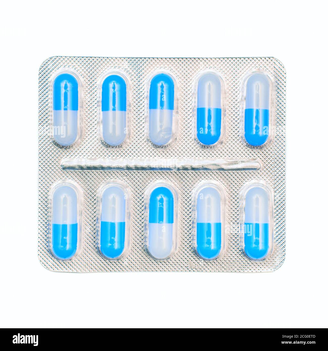 Blister pack of blue and white capsules isolated on white background ...
