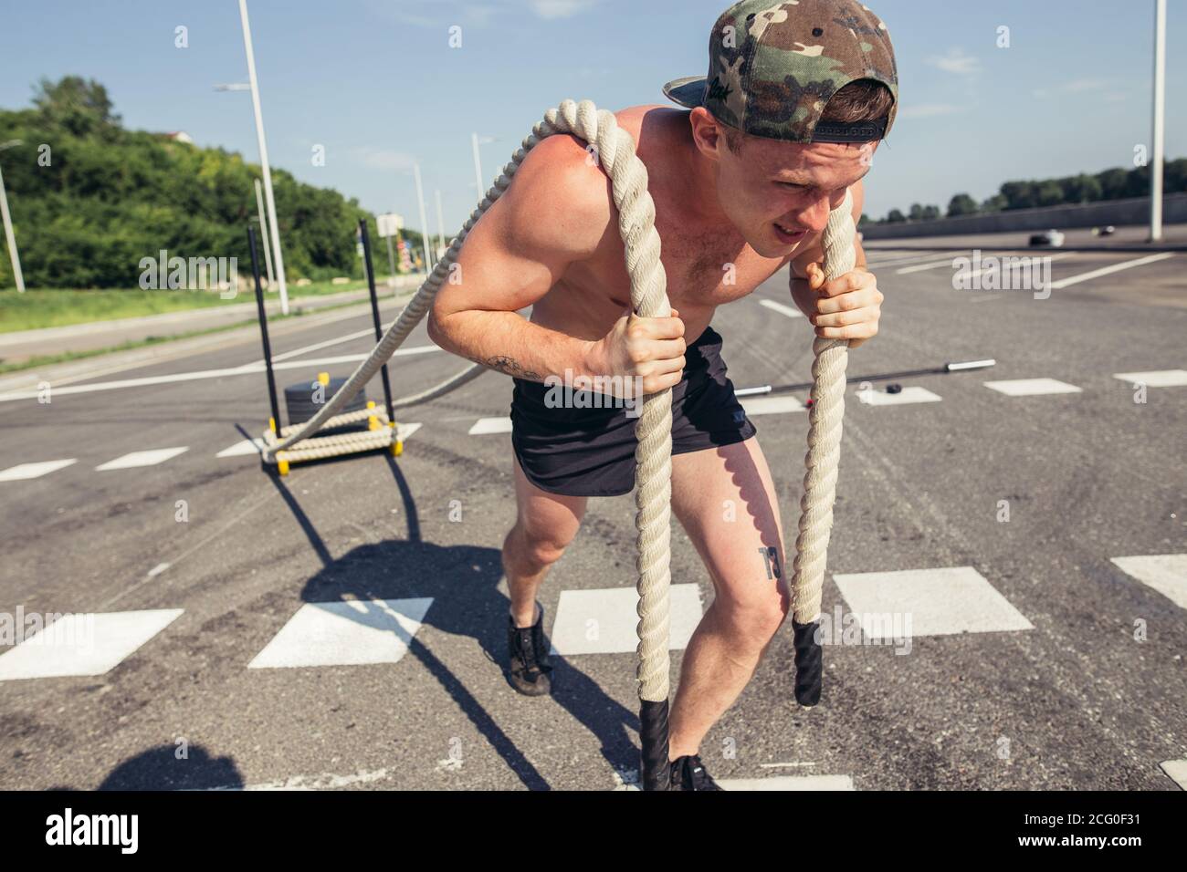 Sled push man pushing weights hi-res stock photography and images - Alamy