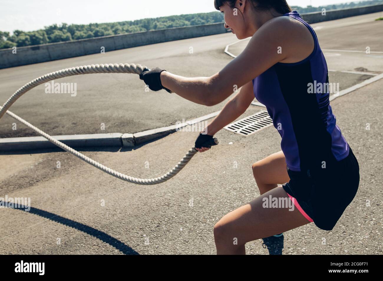 battling ropes woman outdoor workout exercise fitted body Stock Photo ...