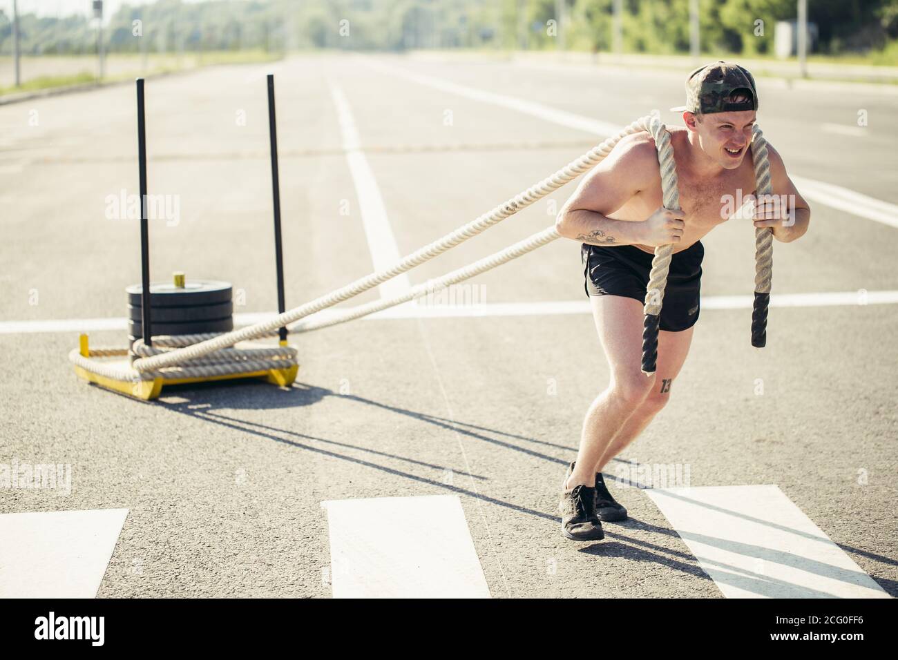 Sled push man pushing weights hi-res stock photography and images - Alamy