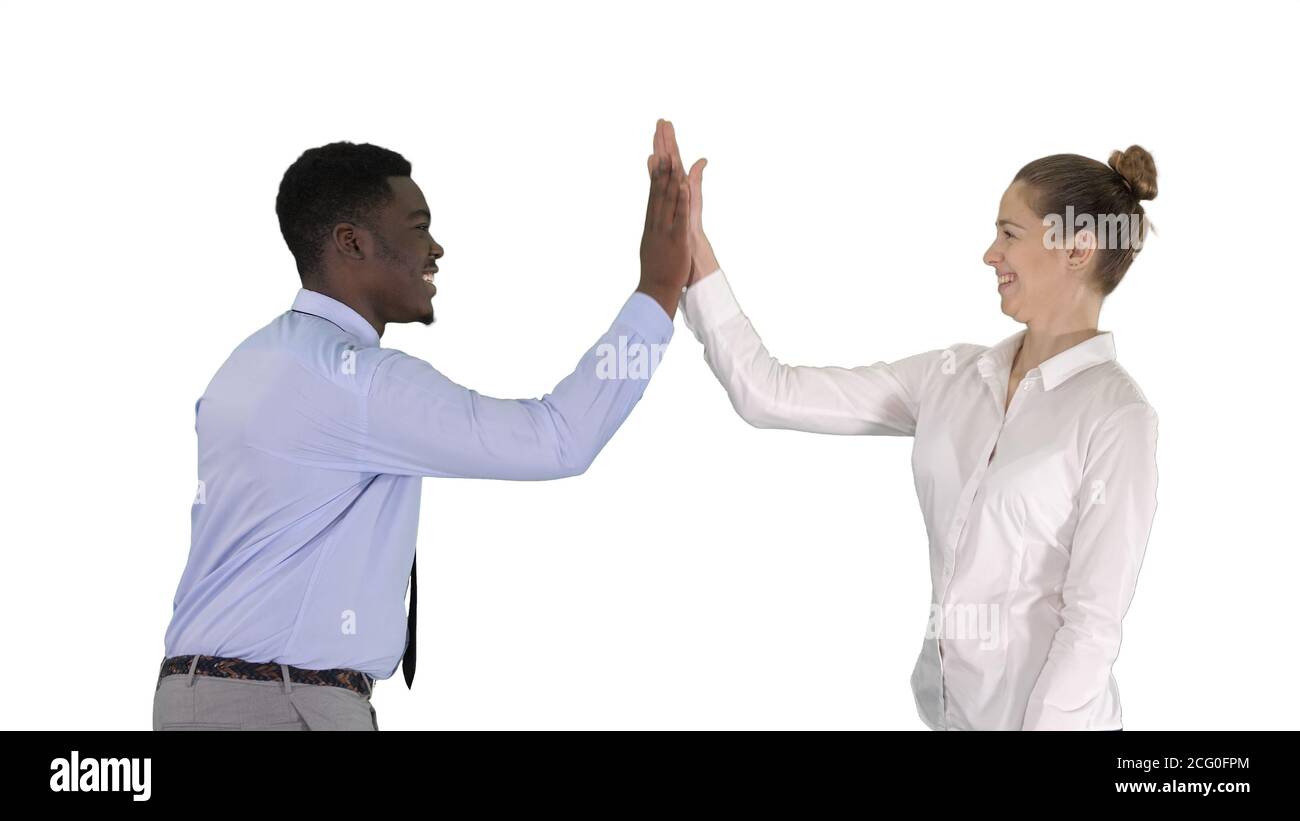 Young woman and young man in formal clothes give high five on white ...