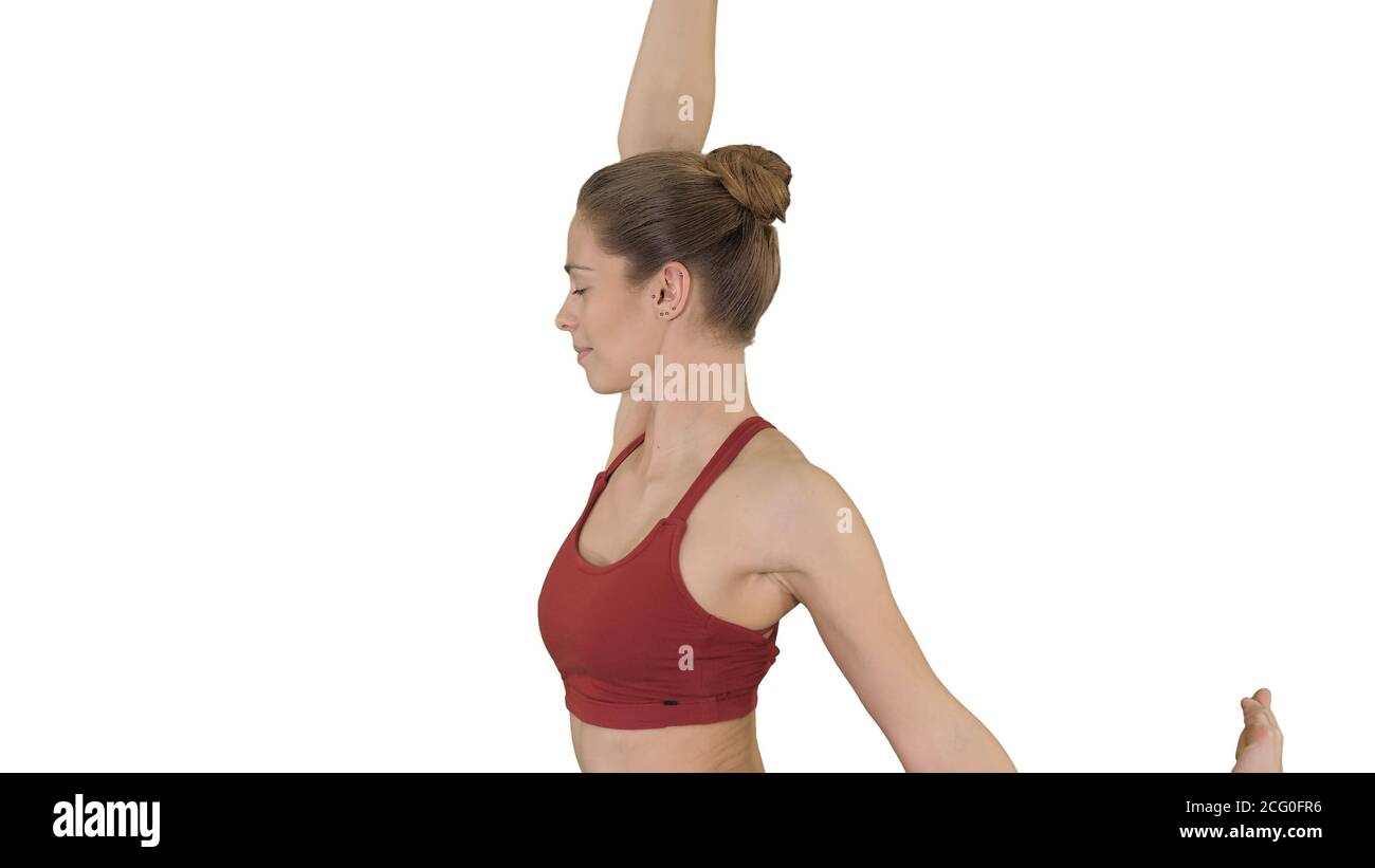 Young sporty attractive woman practicing yoga on white background Stock ...