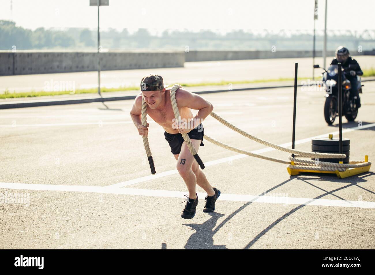 Sled push man pushing weights hi-res stock photography and images - Alamy