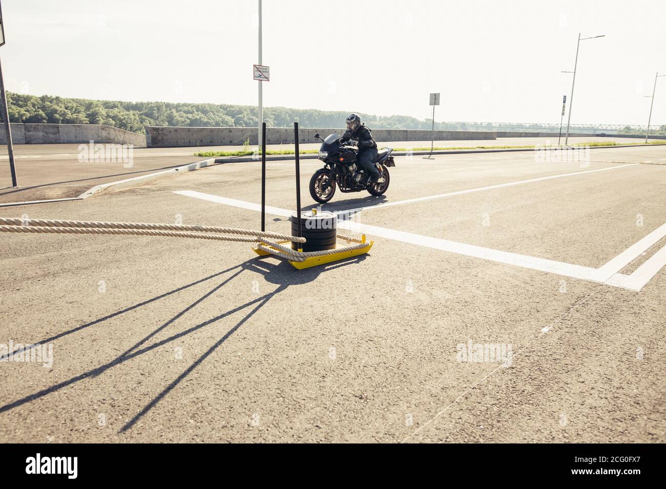 sled push man pushing weights workout and competing with motorcycle ...