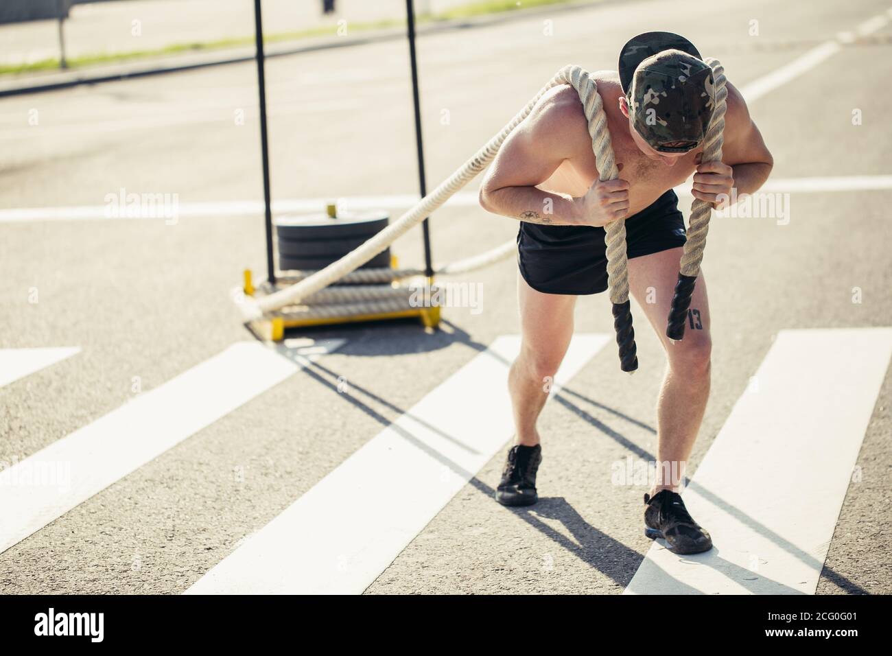 Sled push man pushing weights hi-res stock photography and images - Alamy