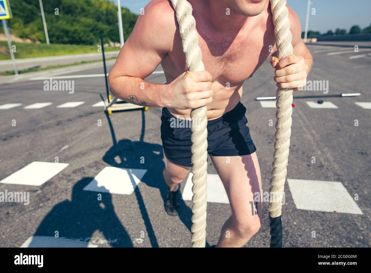 Sled push man pushing weights hi-res stock photography and images - Alamy