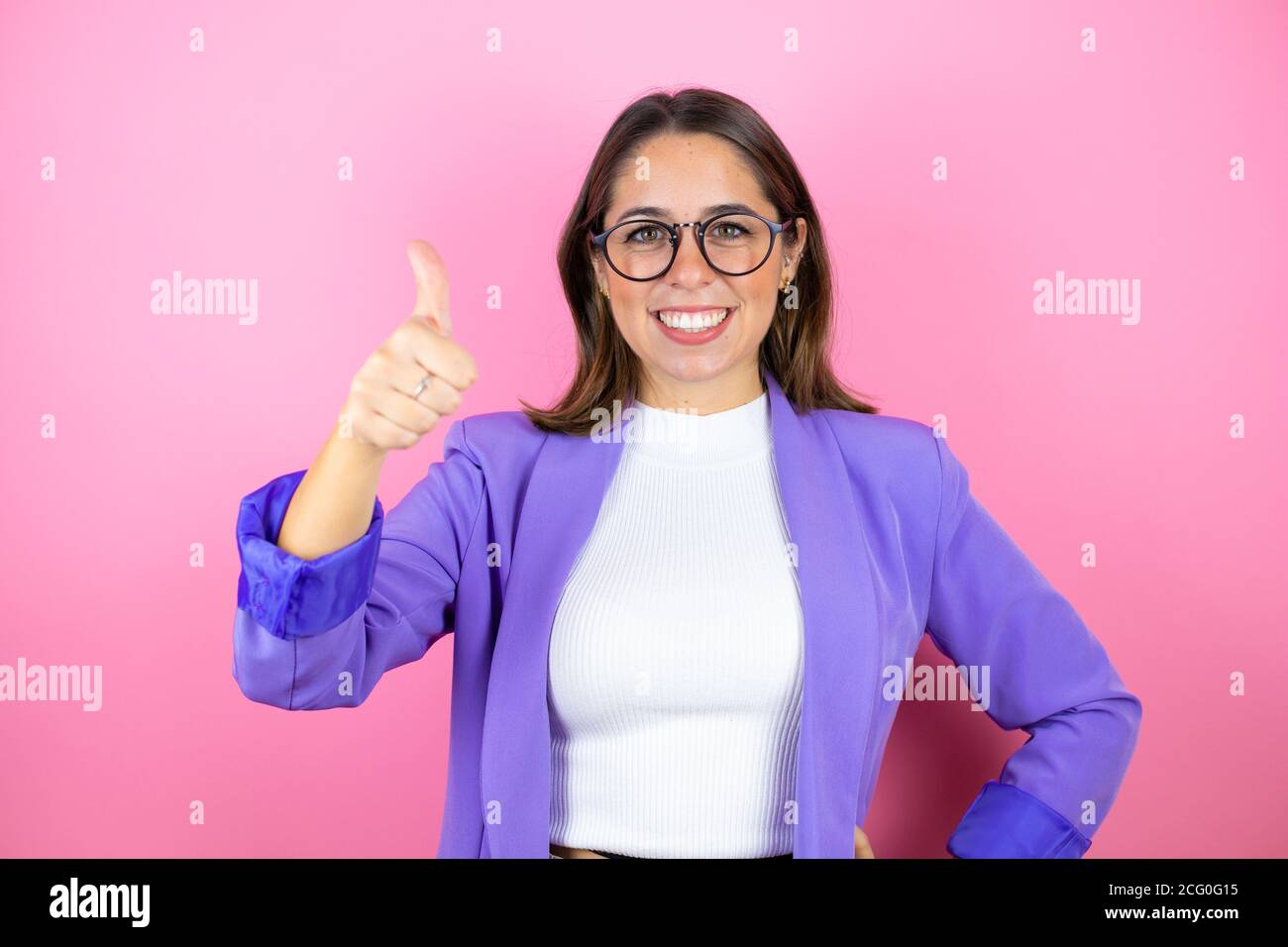 Young beautiful business woman over isolated pink background smiling ...
