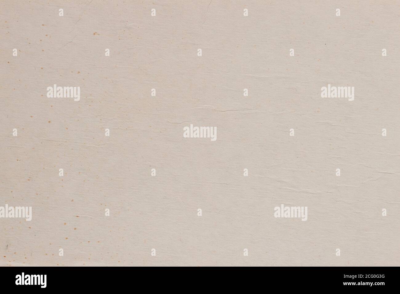 Texture of the cardboard, cream color with various dirt specks, folds ...