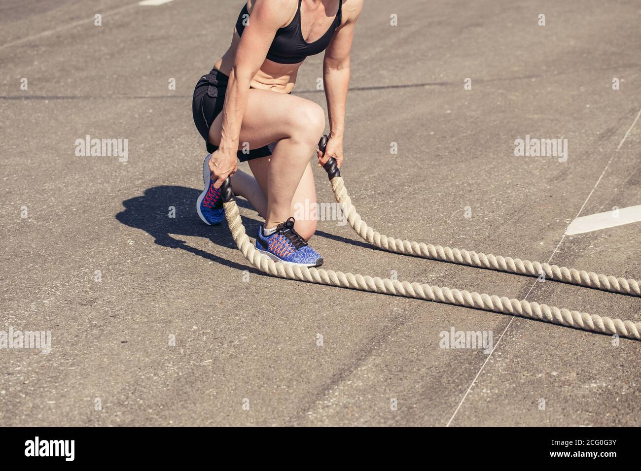 Young woman exercising outdoor resistance hi-res stock photography and ...