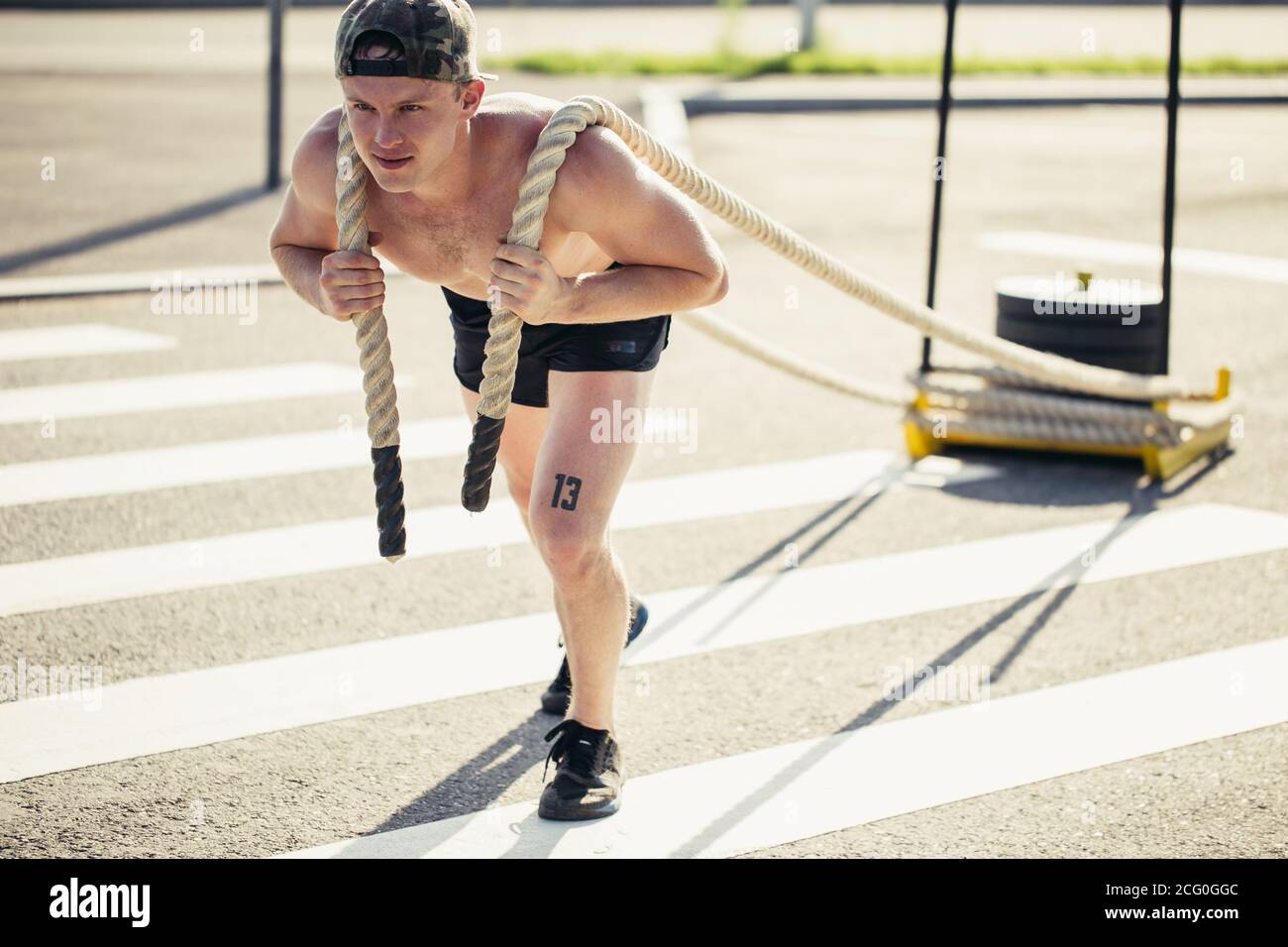 Sled push man pushing weights hi-res stock photography and images - Alamy
