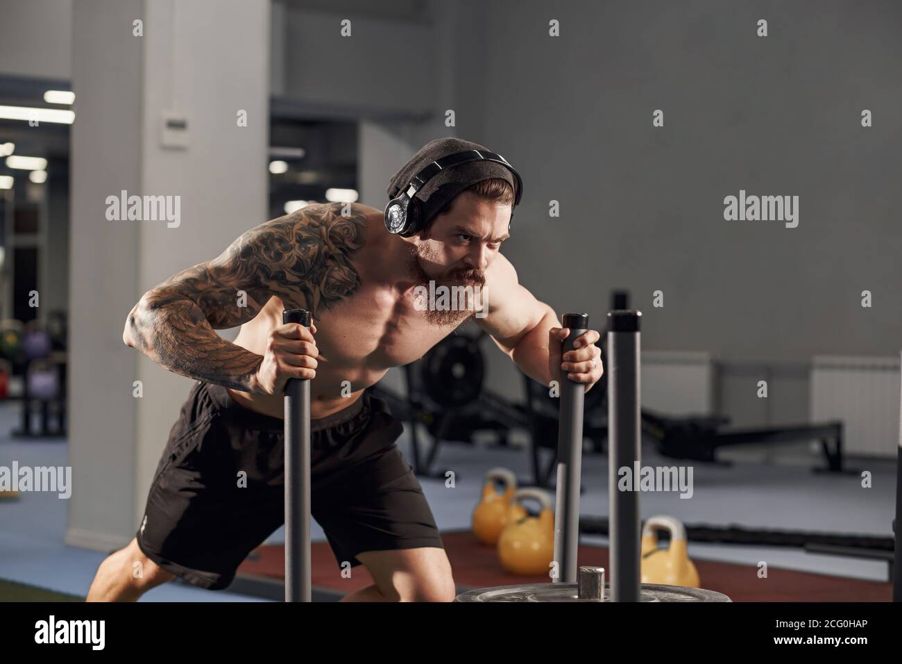 Sled push man pushing weights hi-res stock photography and images - Alamy