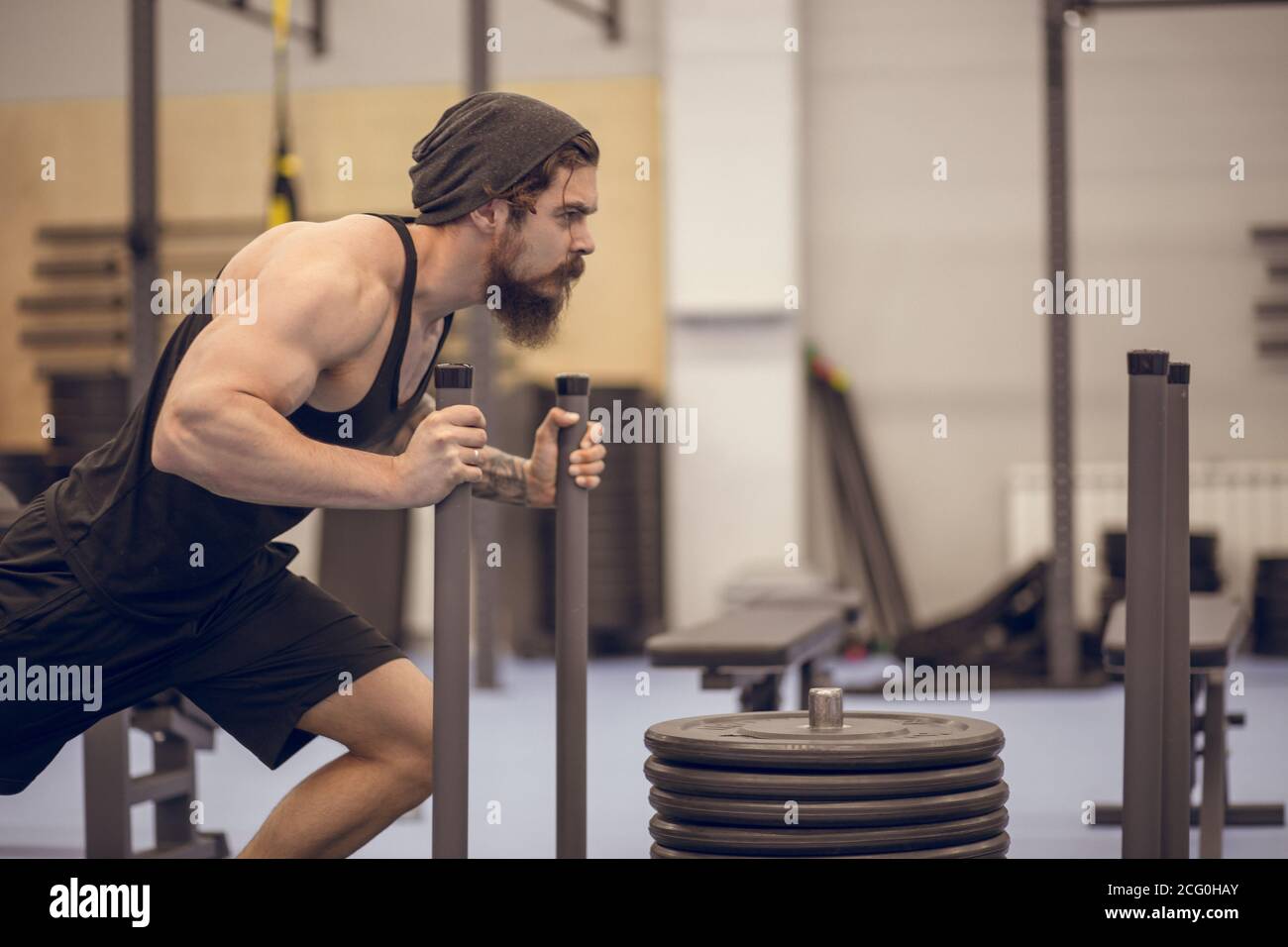 Sled push man pushing weights hi-res stock photography and images - Alamy