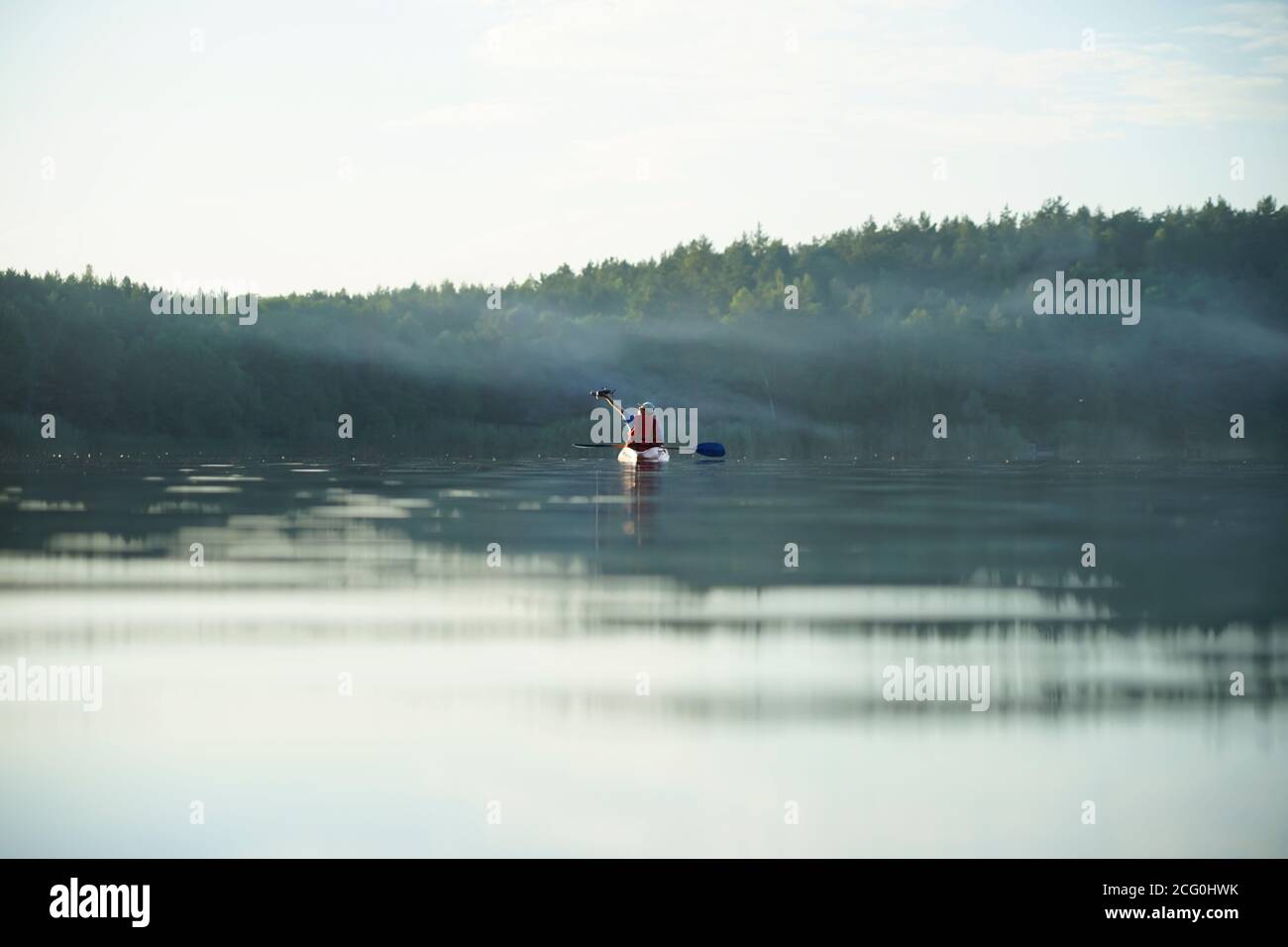 guy launches drone from boat over water Stock Photo - Alamy