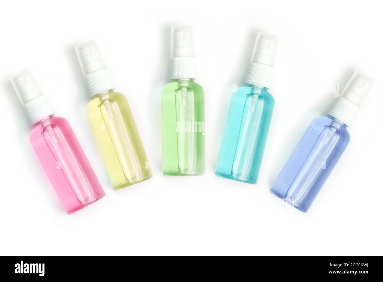 five multi-colored spray bottles made of plastic, with hand sanitizer ...