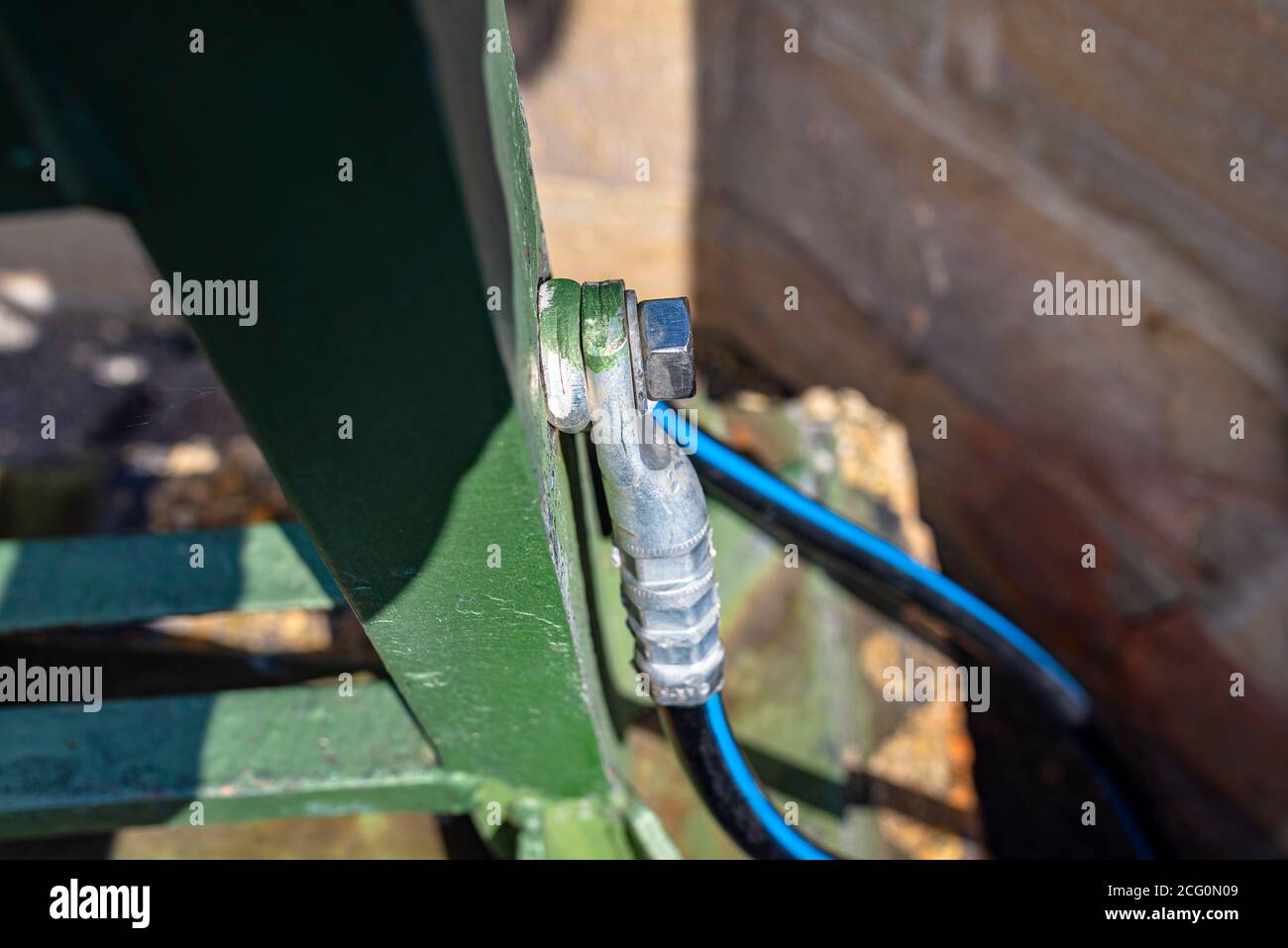A grounding cable connecting the metal railings on the railway bridge ...