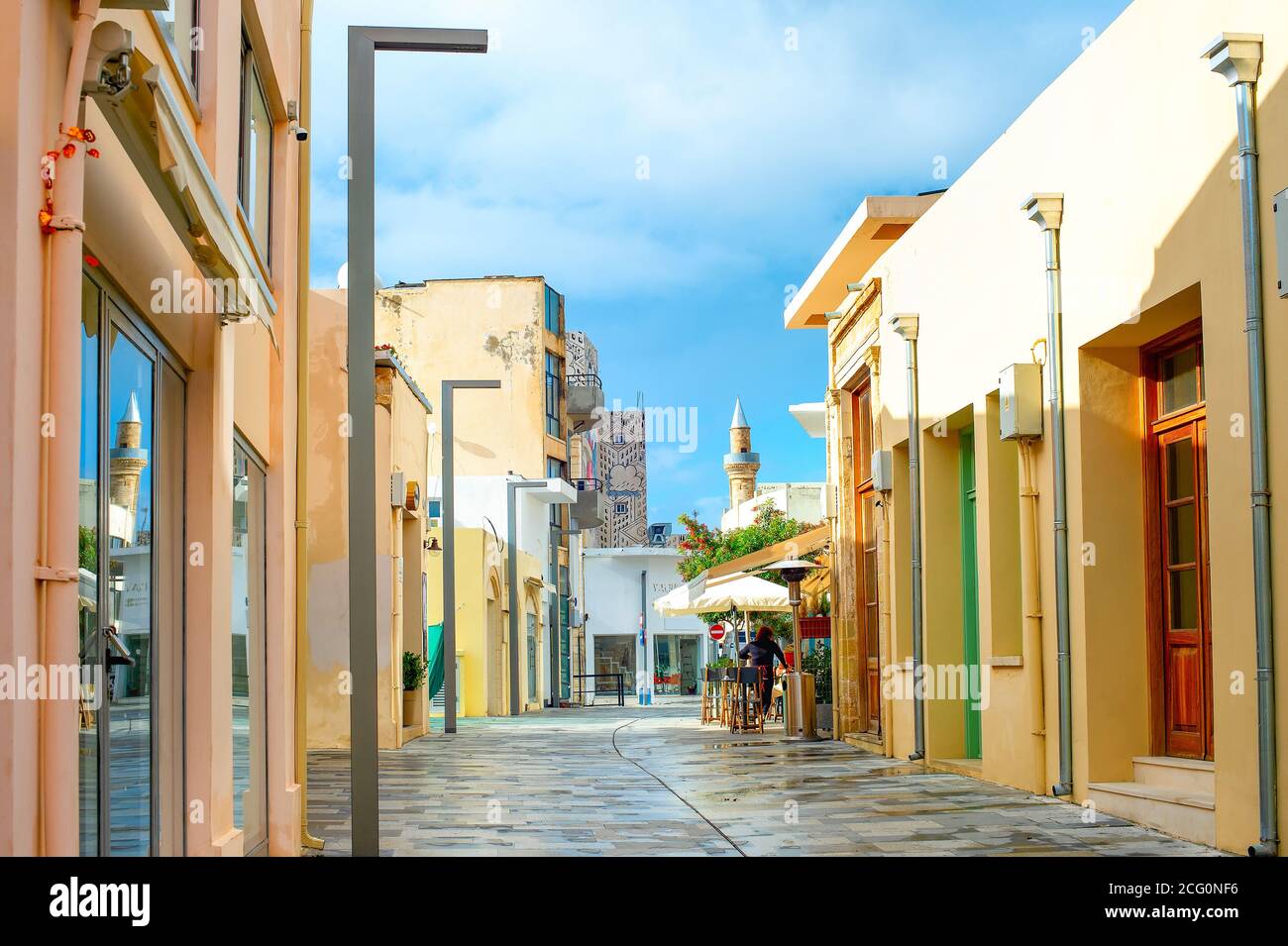 Central touristic street with restaurants and shops, mosque in ...
