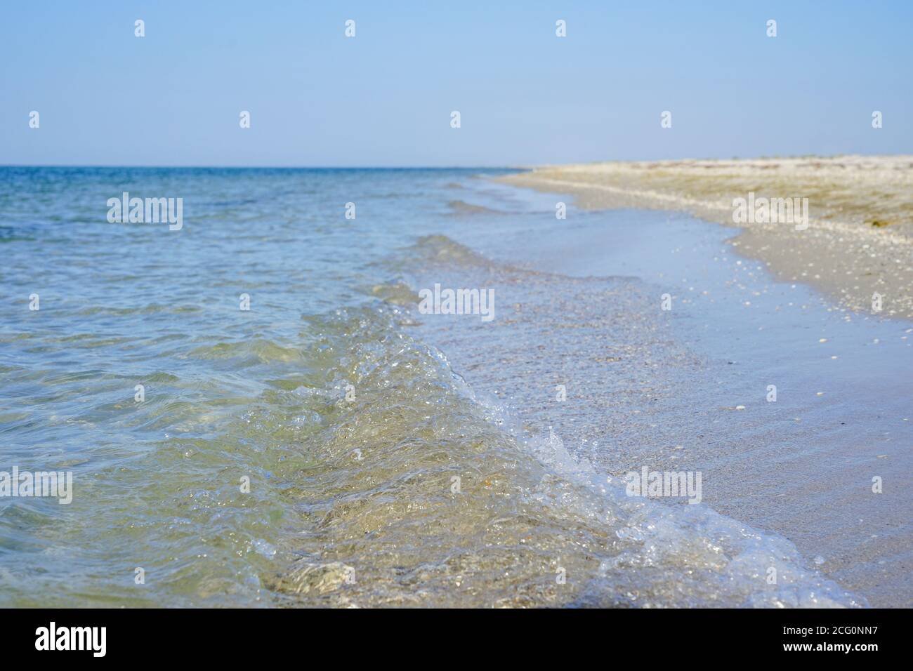 azure sea with clear waters off the coast of a white sand island Stock ...