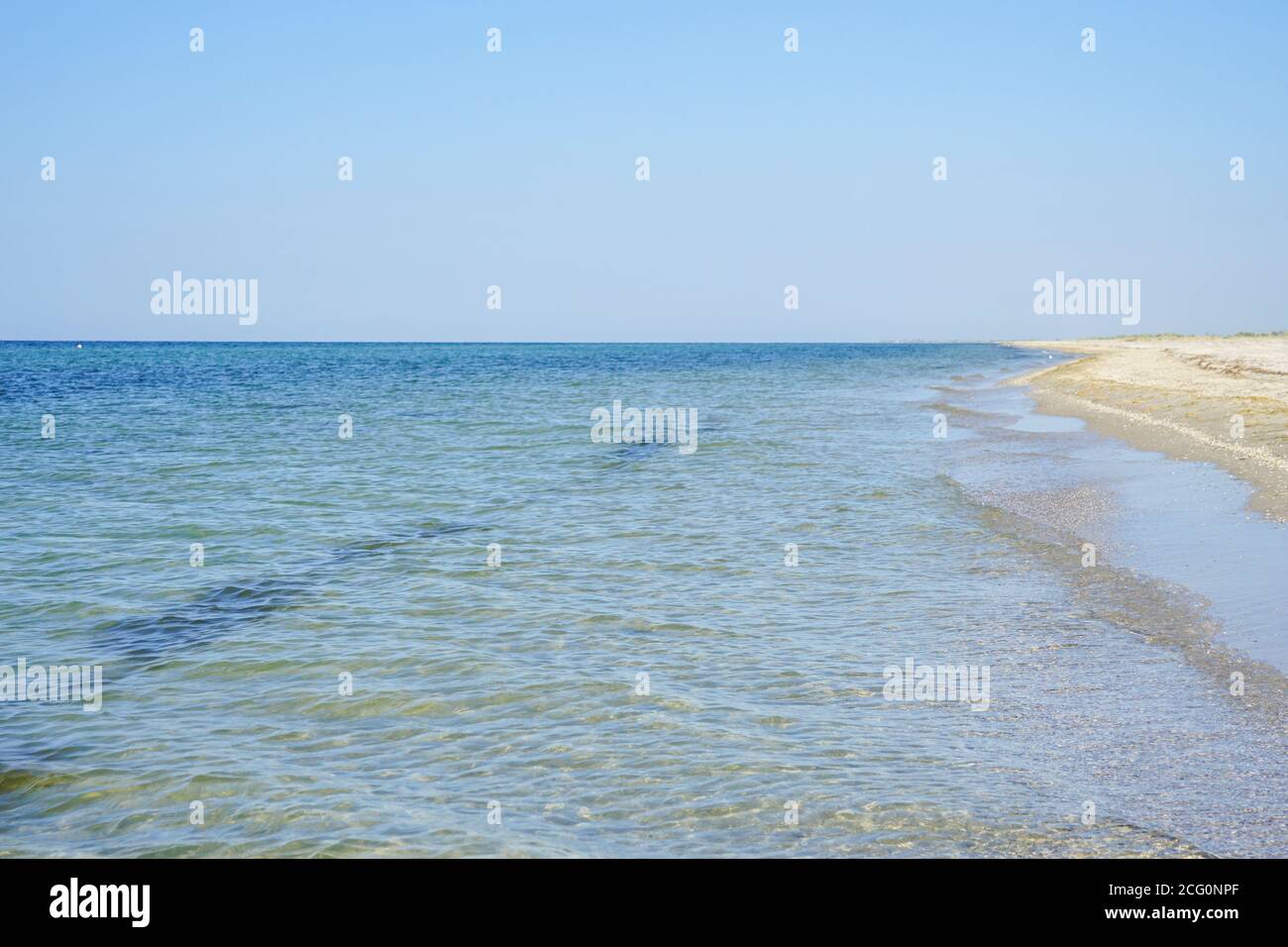azure sea with clear waters off the coast of a white sand island Stock ...