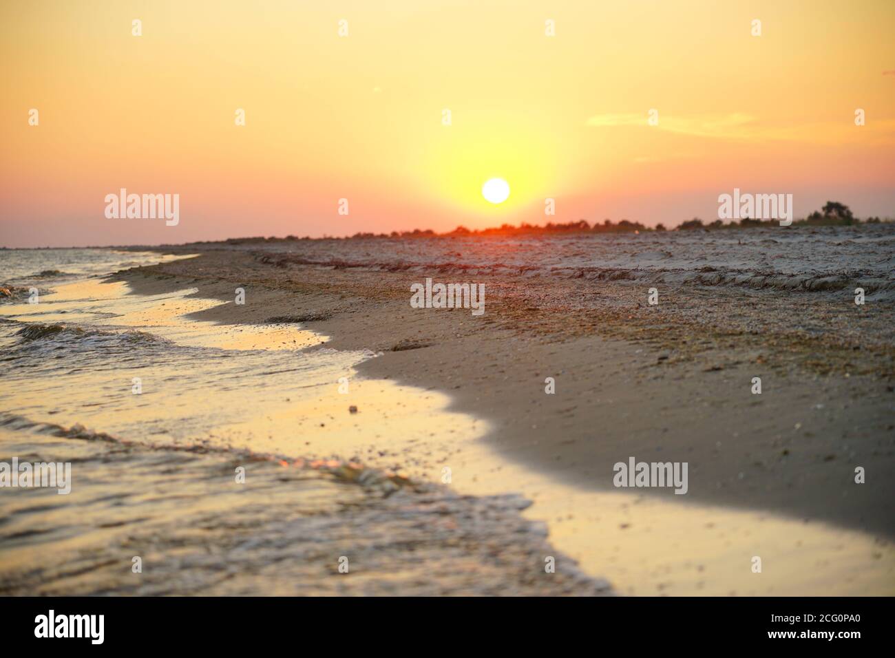 beautiful sunset on an island in the sea Stock Photo - Alamy