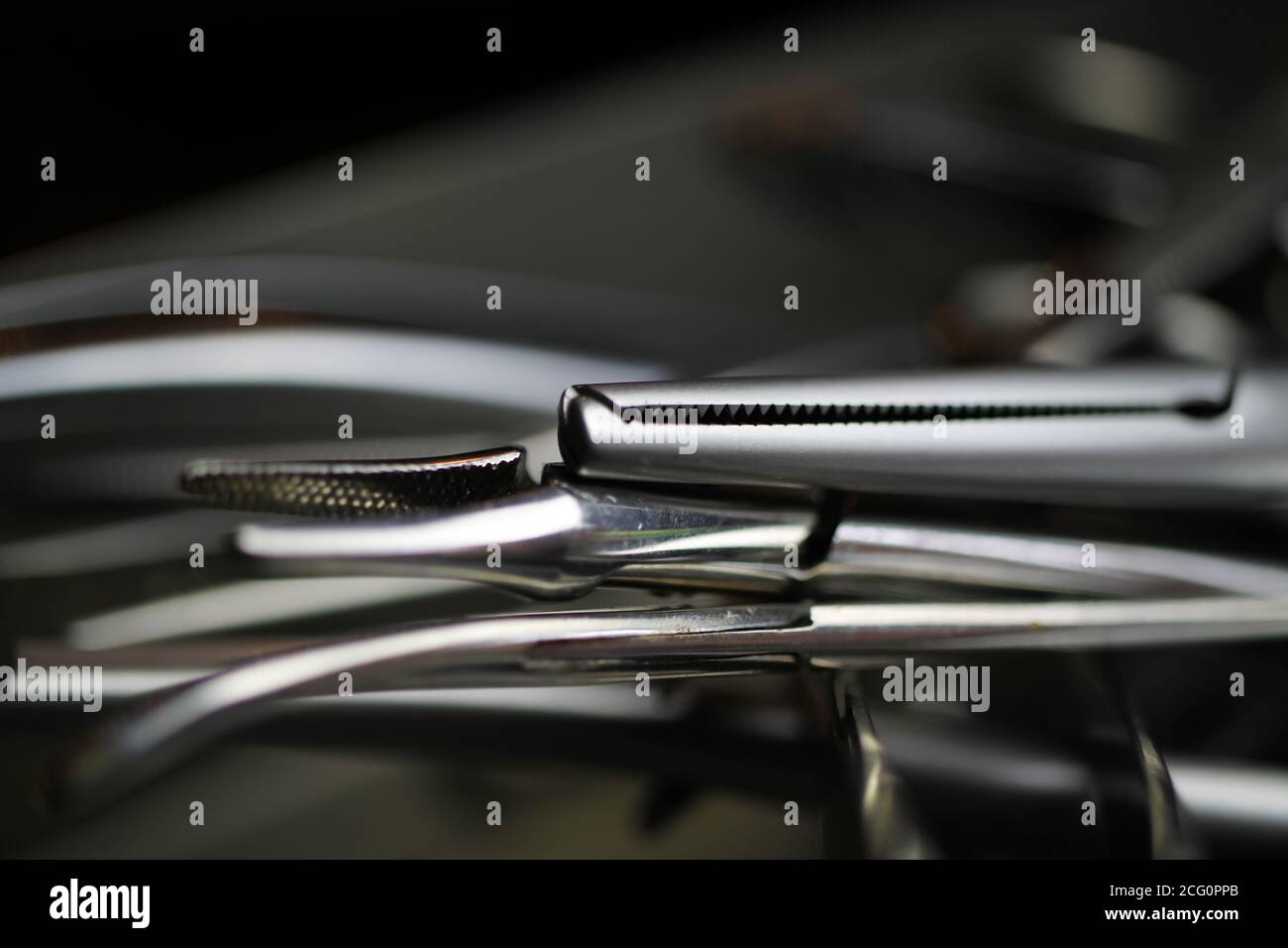 Macro closeup of surgical steel needle clamp Stock Photo - Alamy