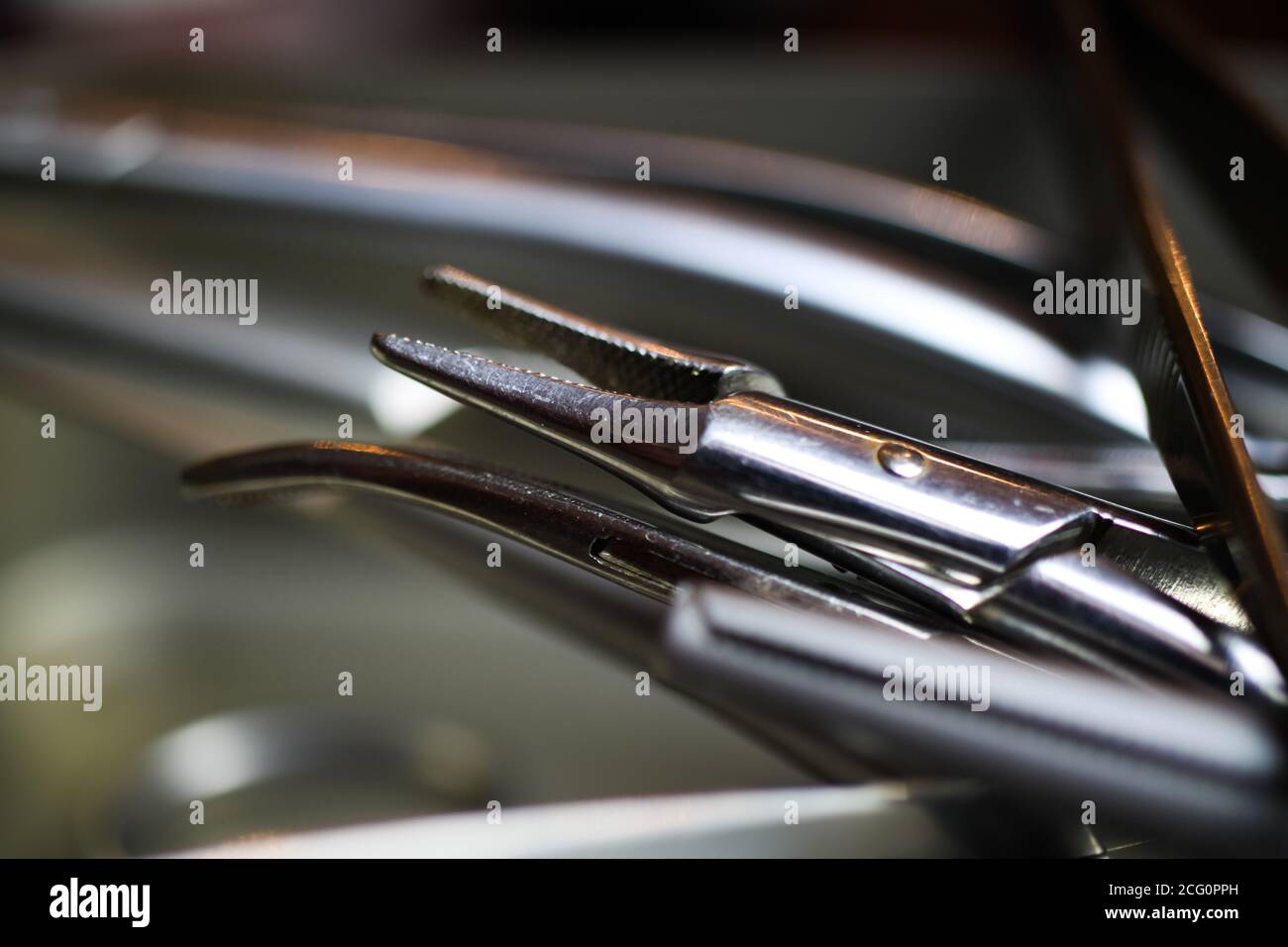 Macro closeup of surgical steel needle clamp Stock Photo - Alamy