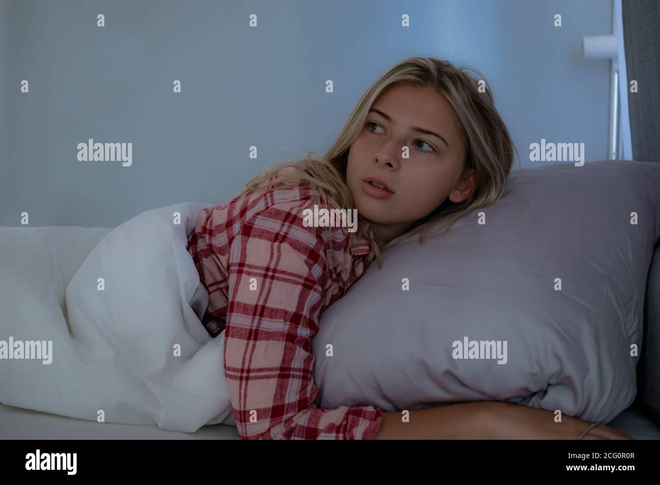 Woman scared bed night hi-res stock photography and images - Alamy