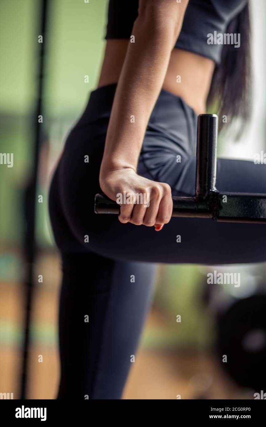 Parallettes woman parallel bars workout exercise at gym Stock Photo - Alamy