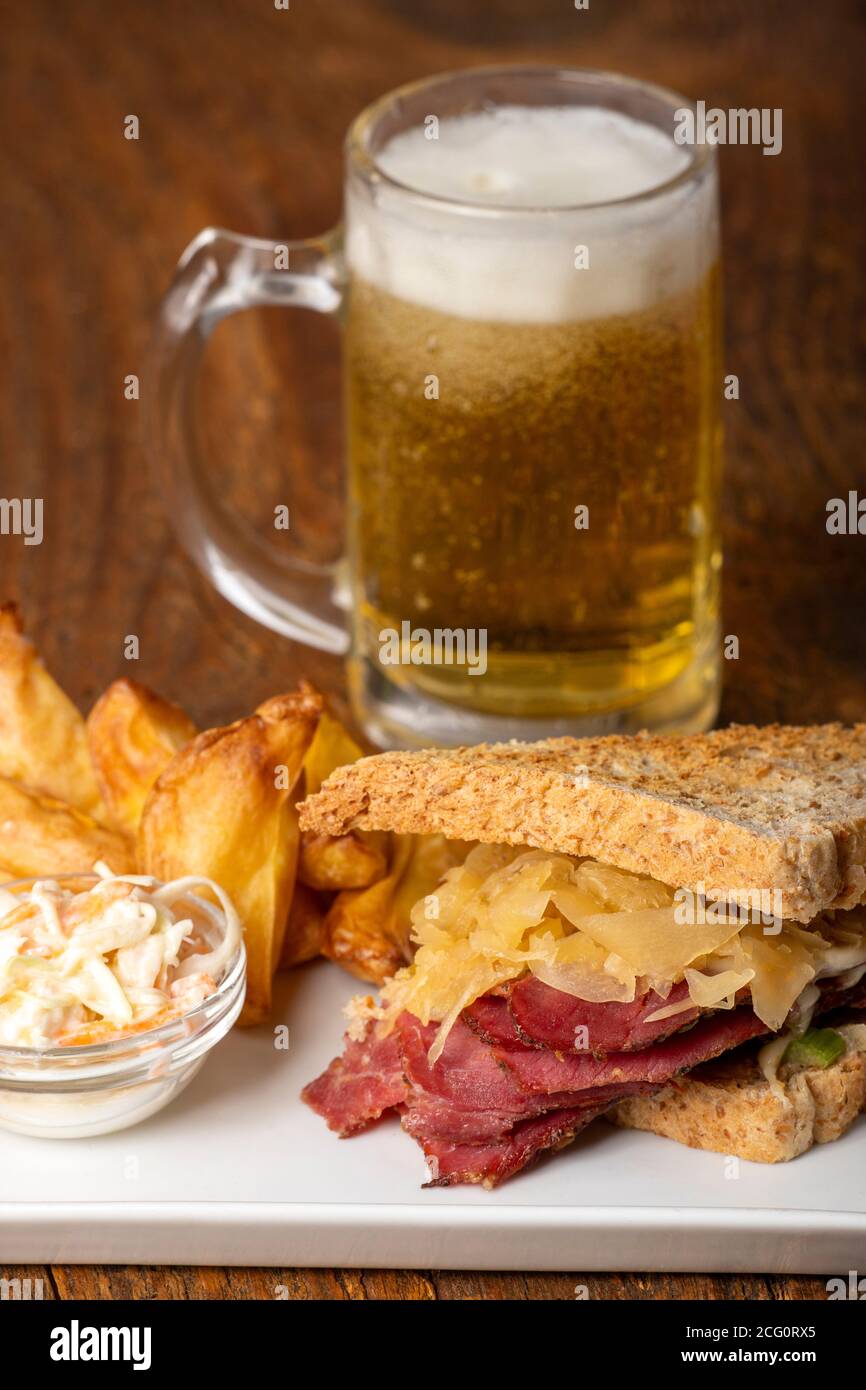 reuben sandwich on a plate with fries Stock Photo - Alamy