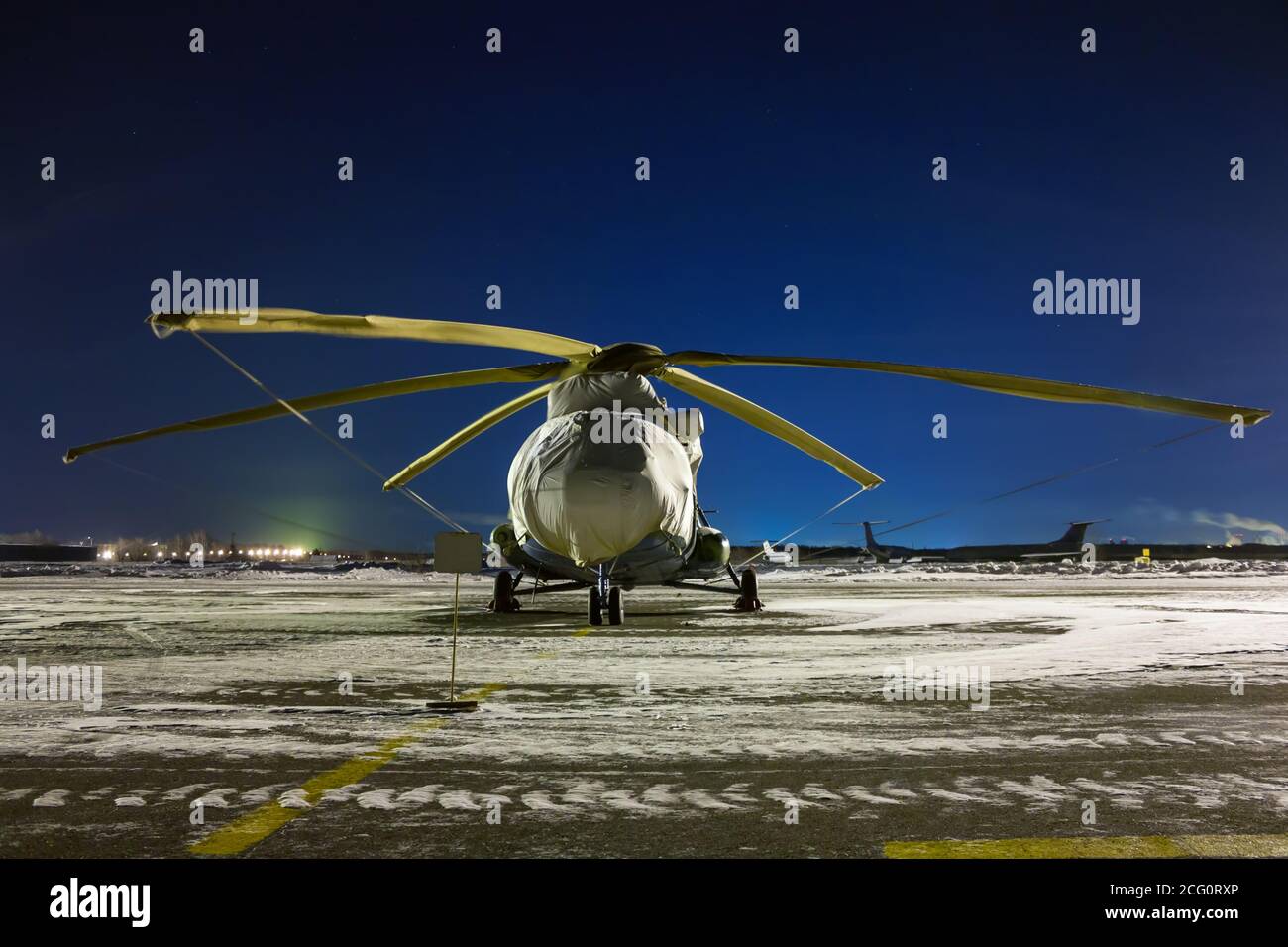 Helicopter asleep at night apron Stock Photo - Alamy